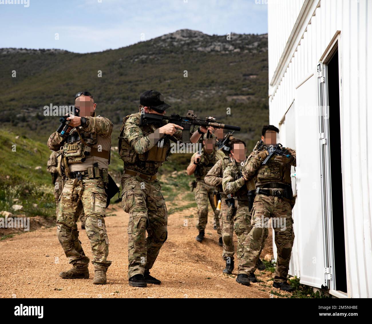 A member of the Greek Z’ Moira Amfivion Katadromon (ZMAK) Special Operations Forces (SOF) (left ...