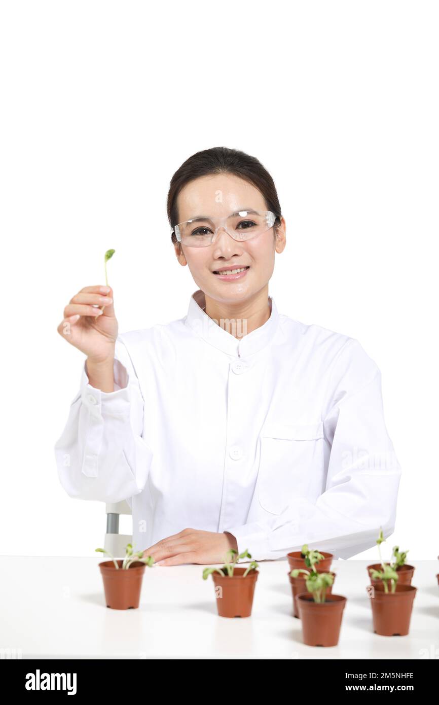 Young women scientists study looked at plants Stock Photo - Alamy