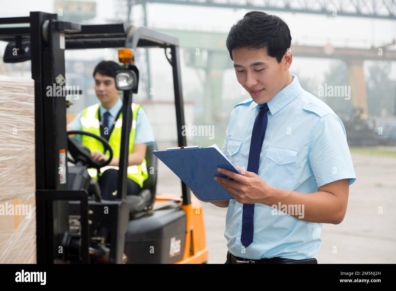 Logistics warehouse management personnel to check the goods Stock Photo ...