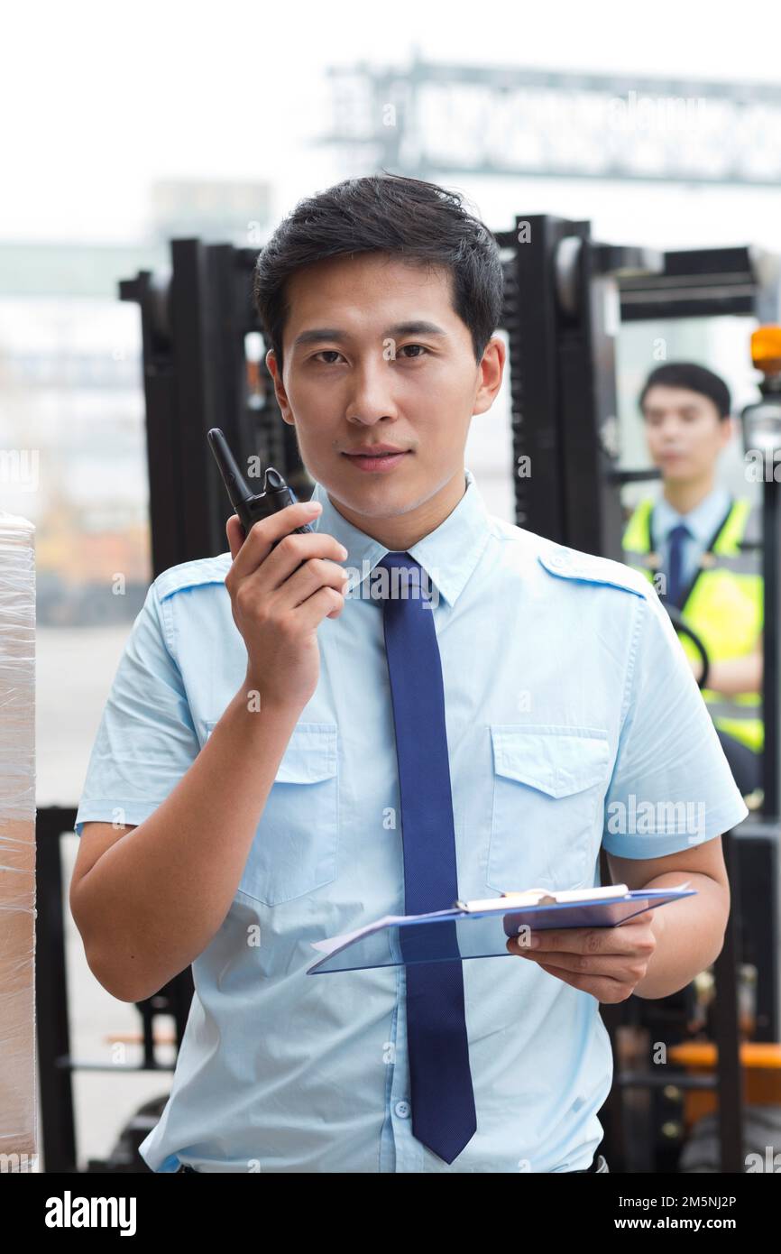 Logistics warehouse management personnel to check the goods Stock Photo ...