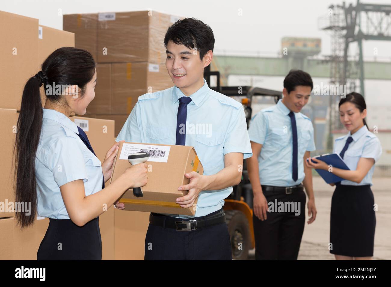 Scan cargo logistics warehouse management personnel Stock Photo - Alamy