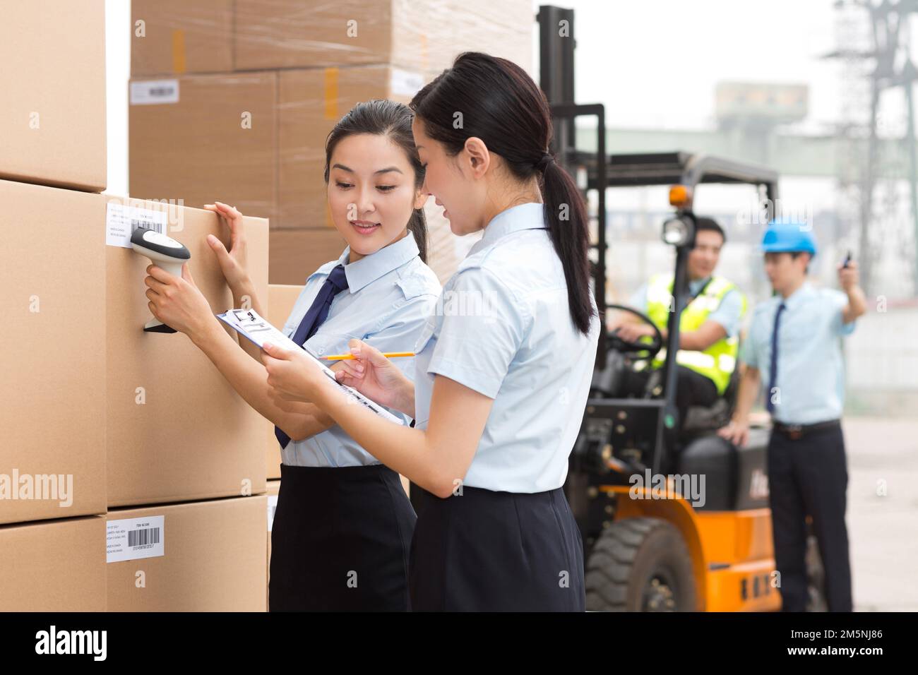 Logistics warehouse management personnel to check the goods Stock Photo ...
