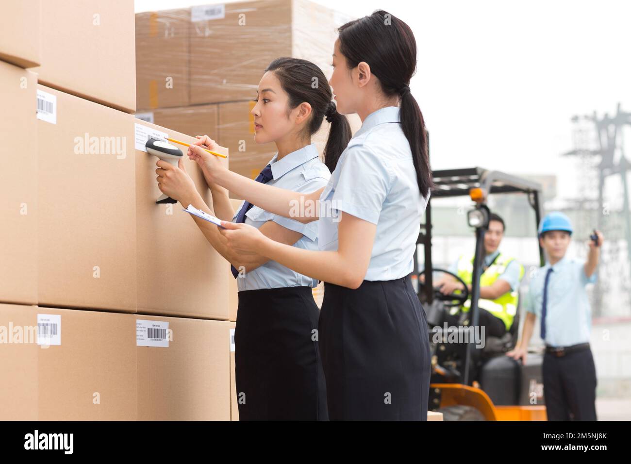 Logistics warehouse management personnel to check the goods Stock Photo ...