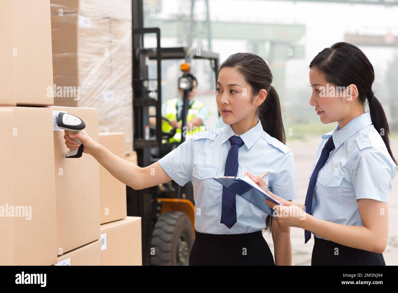 Logistics warehouse management personnel to check the goods Stock Photo ...