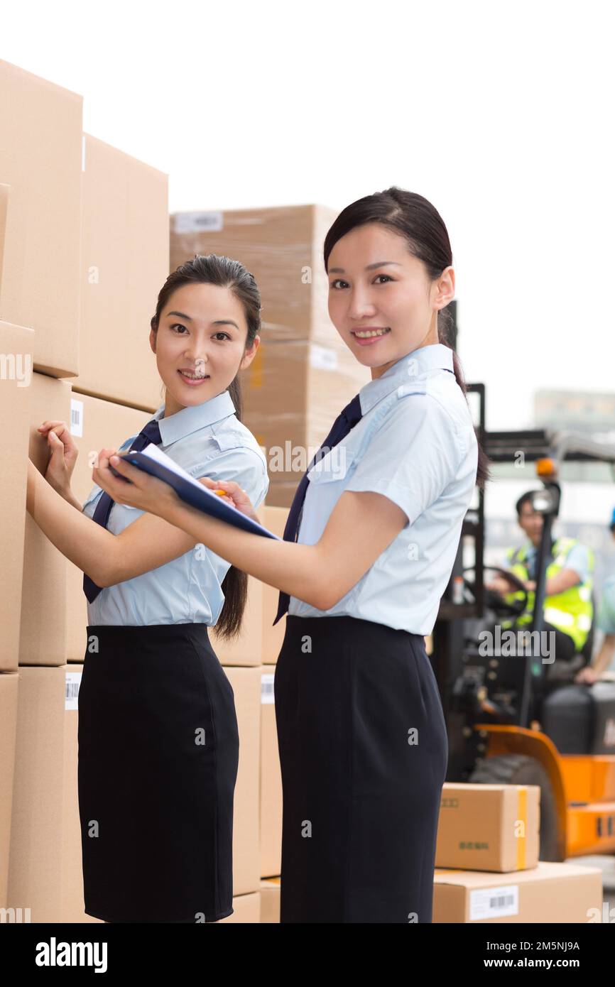 Logistics warehouse management personnel to check the goods Stock Photo ...