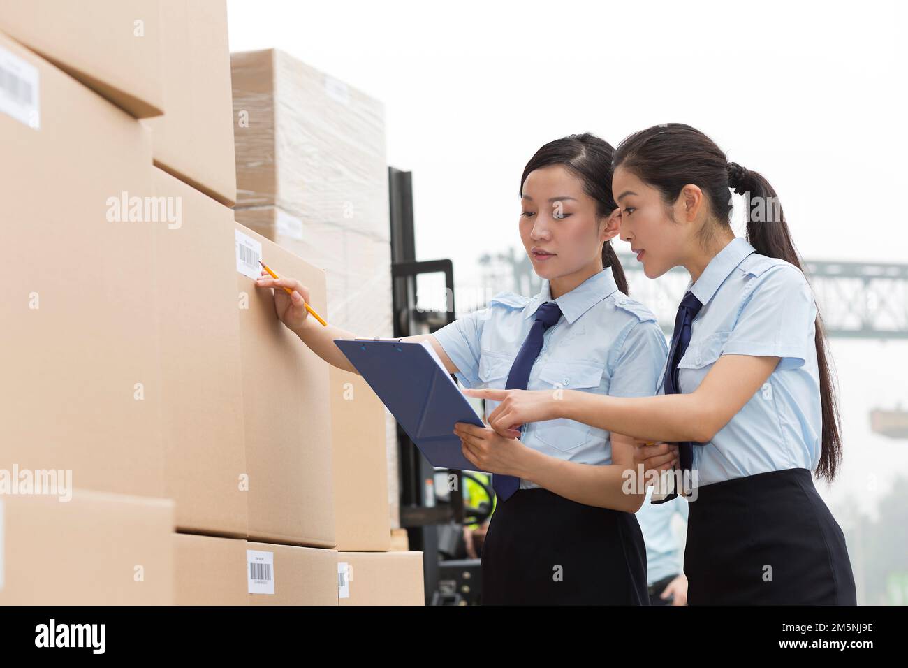 Logistics warehouse management personnel to check the goods Stock Photo ...