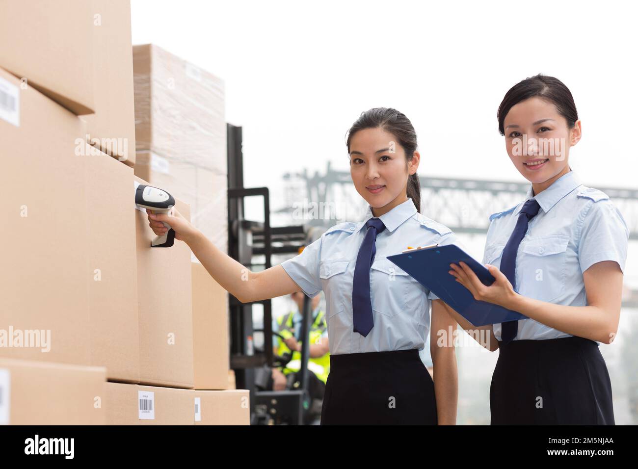 Logistics warehouse management personnel to check the goods Stock Photo ...