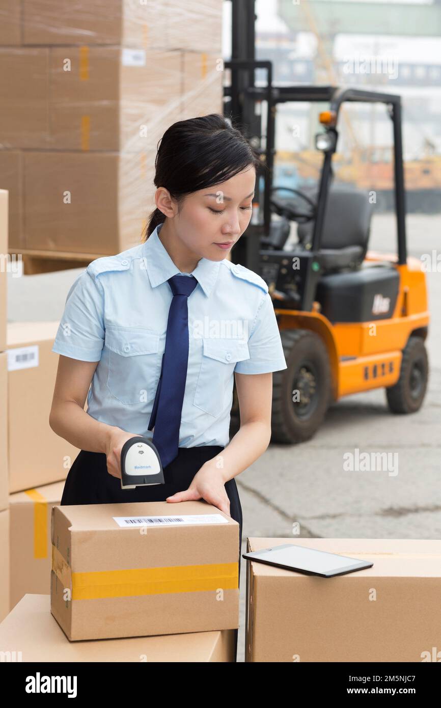 Scan cargo logistics warehouse management personnel Stock Photo - Alamy