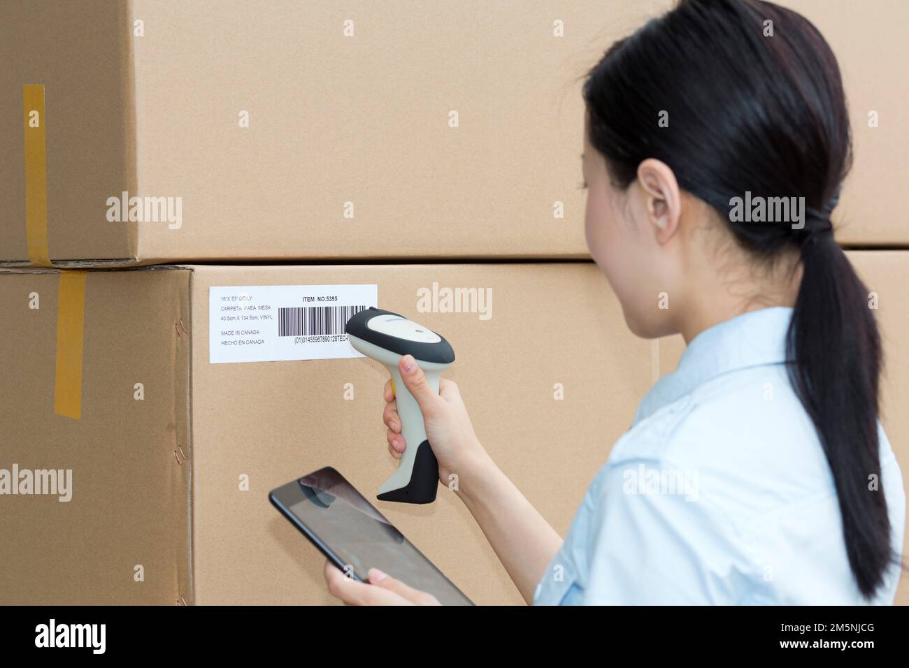 Scan cargo logistics warehouse management personnel Stock Photo - Alamy