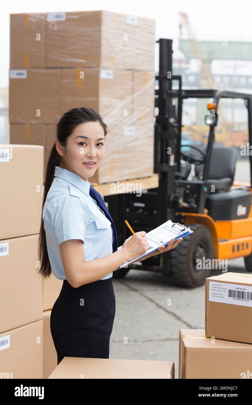 Logistics warehouse management personnel to check the goods Stock Photo ...
