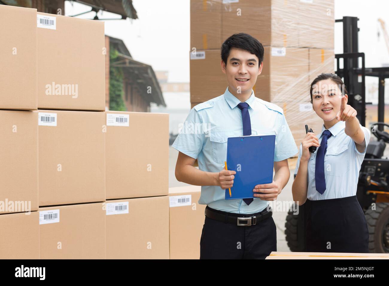 Logistics warehouse management personnel in communication Stock Photo ...