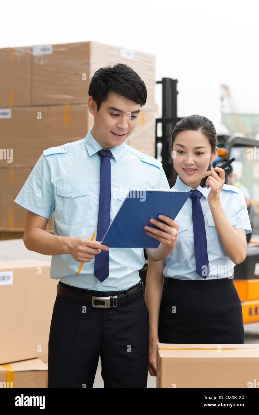 Logistics warehouse management personnel in communication Stock Photo ...