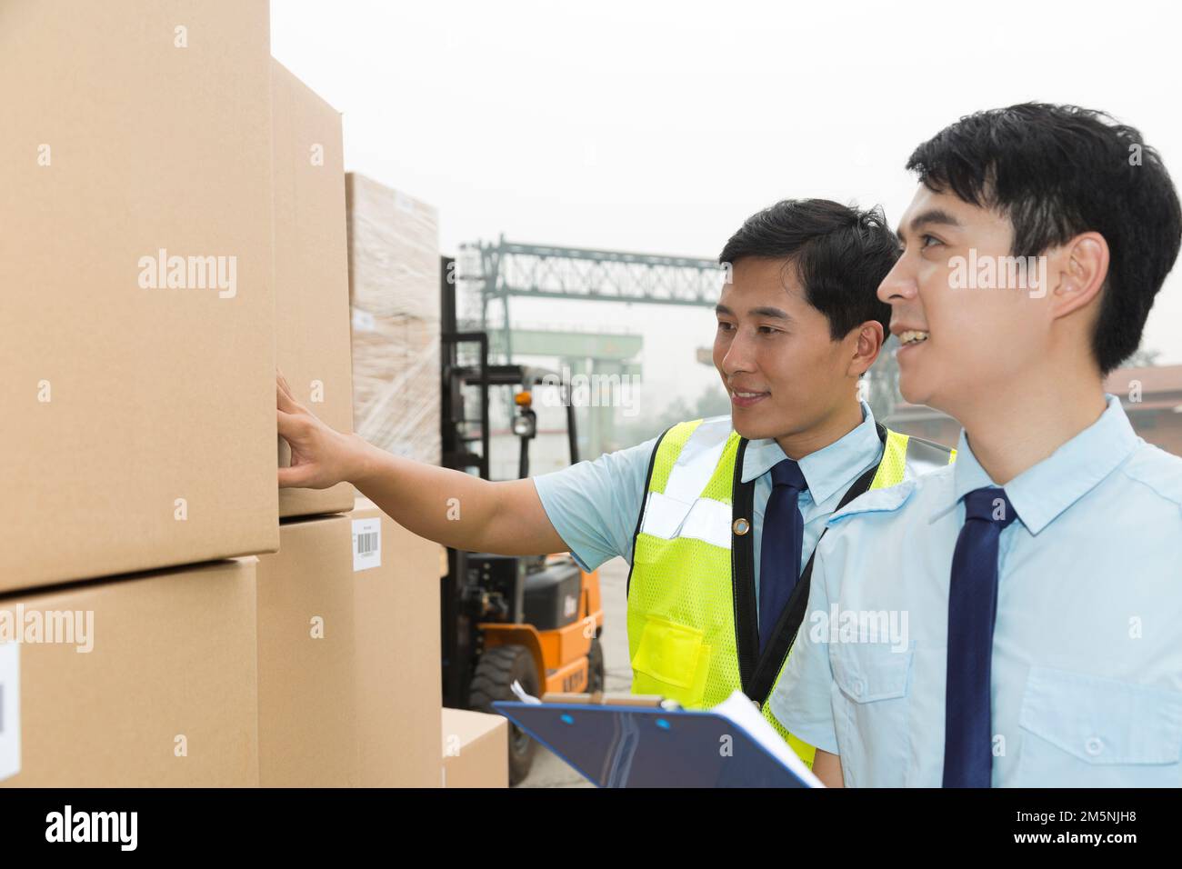 Logistics warehouse management personnel to check the goods Stock Photo ...