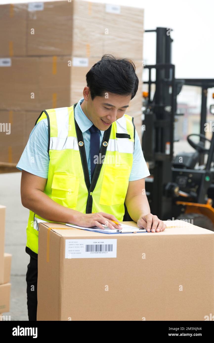 Logistics warehouse management personnel to check the goods Stock Photo ...