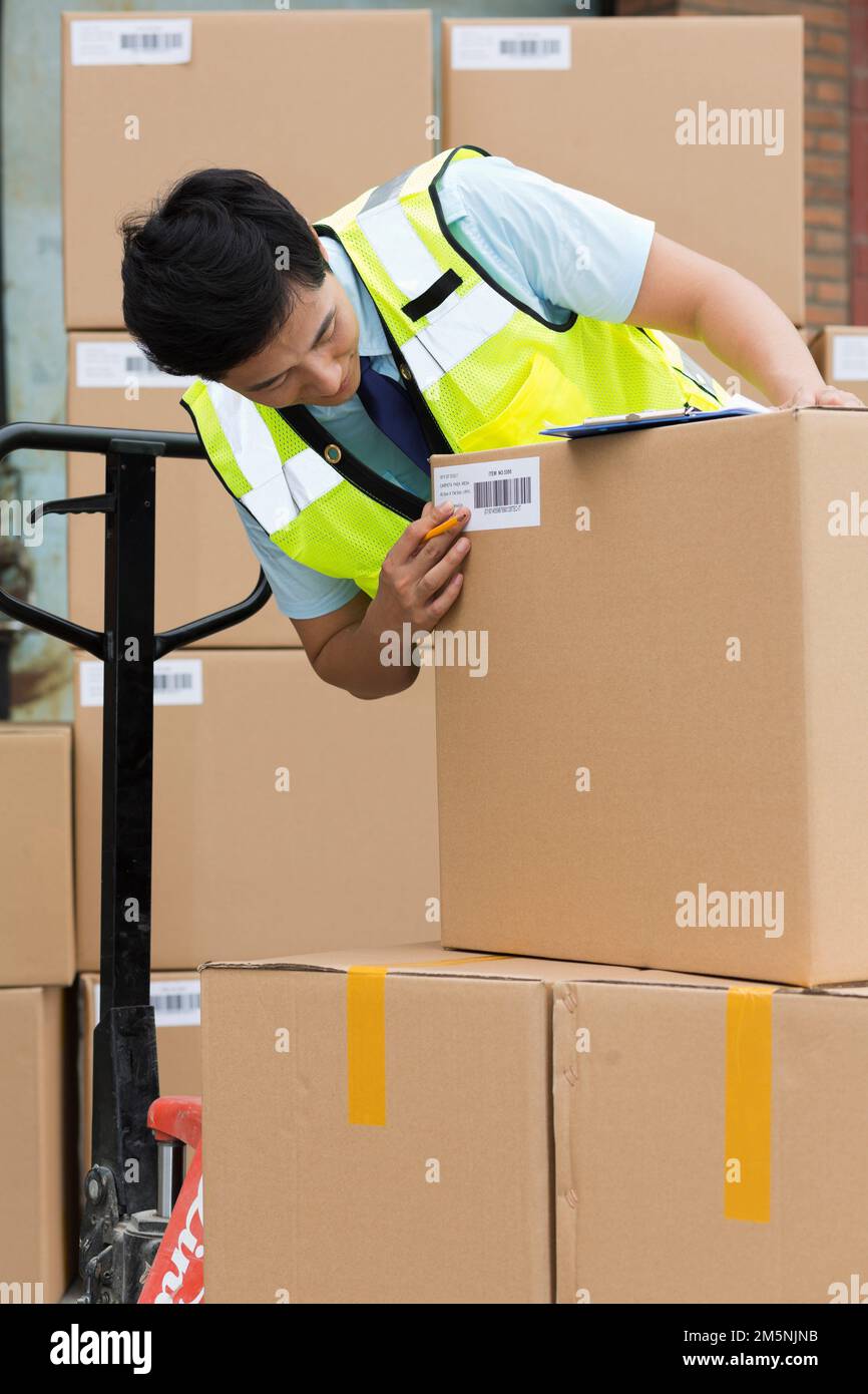 Logistics warehouse management personnel to check the goods Stock Photo ...