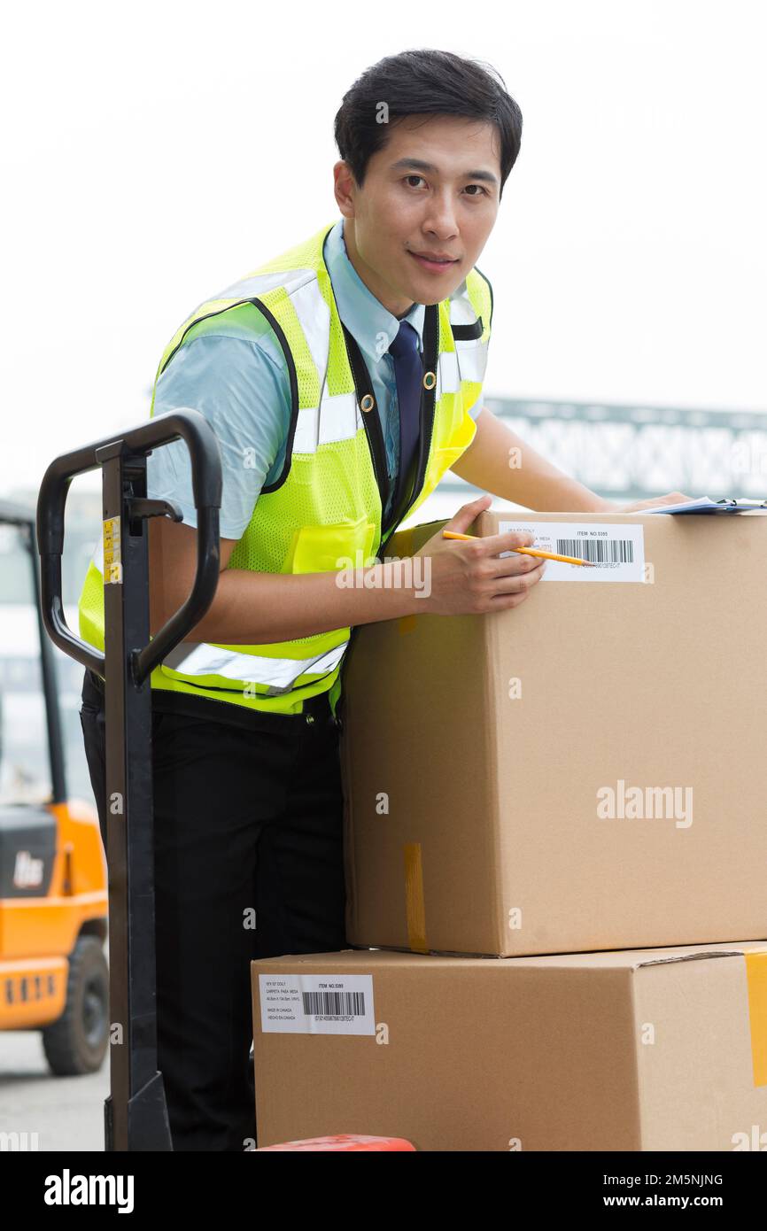 Logistics warehouse management personnel to check the goods Stock Photo ...