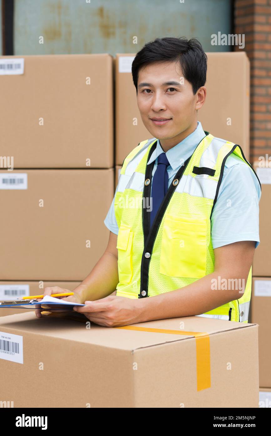 Logistics warehouse management personnel to check the goods Stock Photo ...