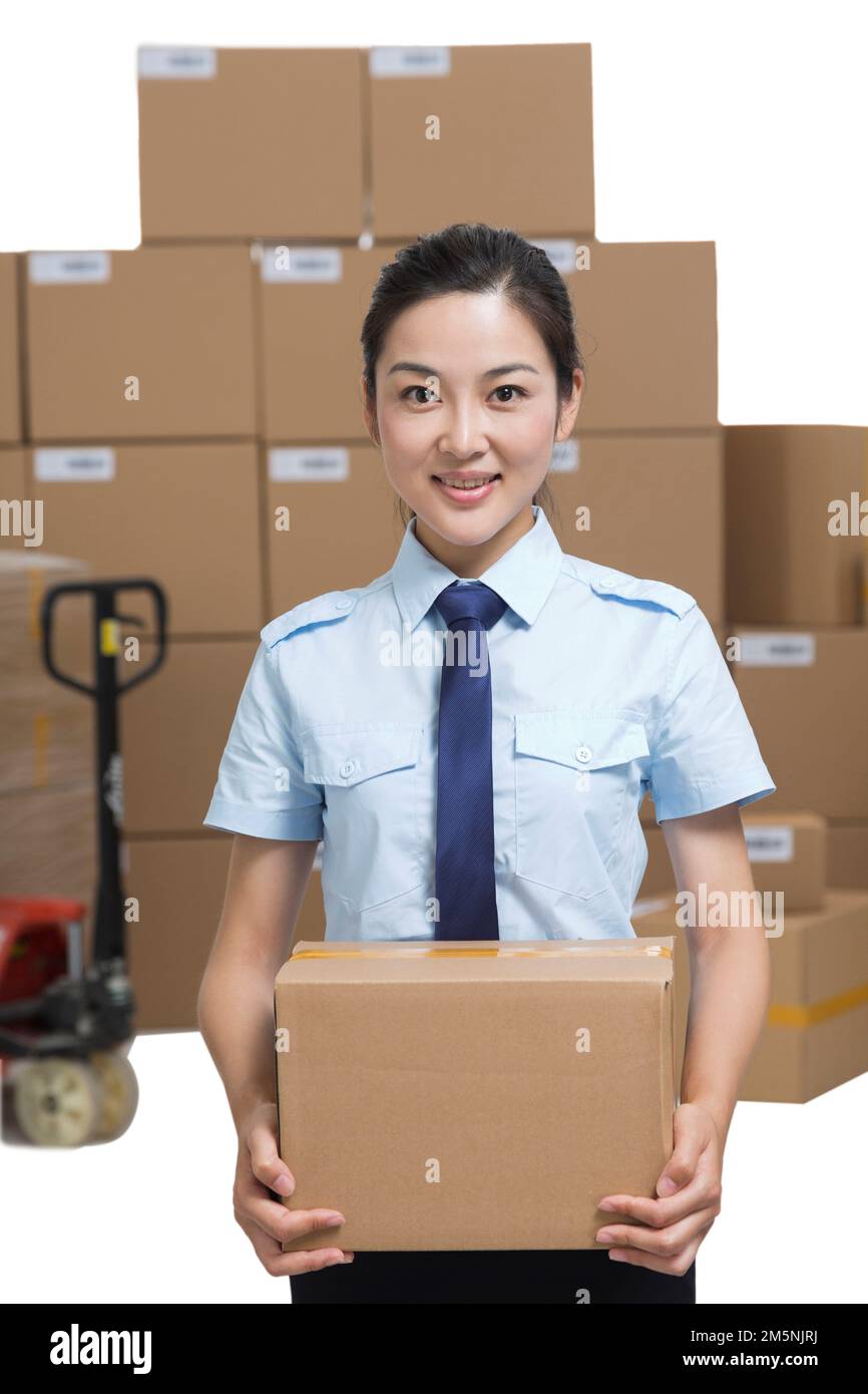 Logistics warehouse staff holding the carton Stock Photo - Alamy
