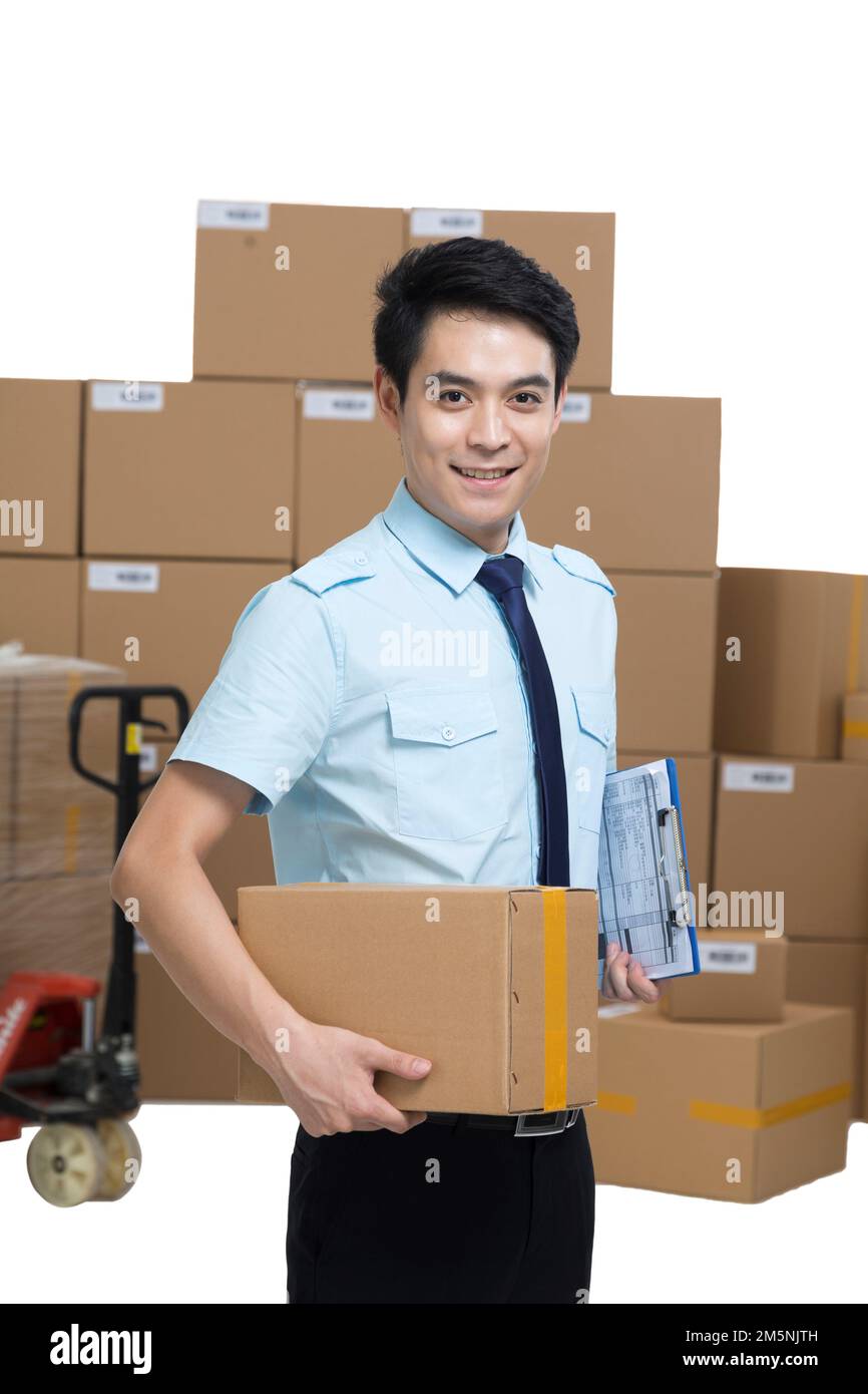 Logistics warehouse staff holding the carton Stock Photo - Alamy