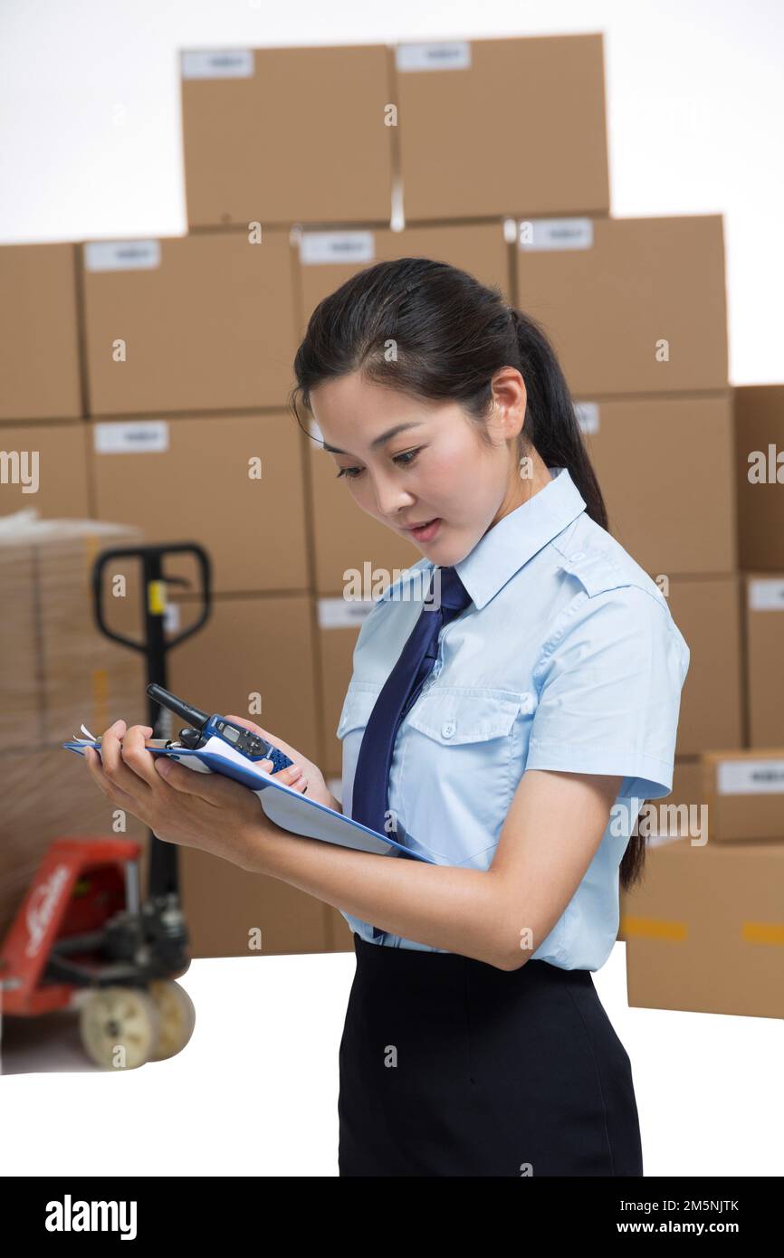 Logistics warehouse staff hand interphone Stock Photo - Alamy