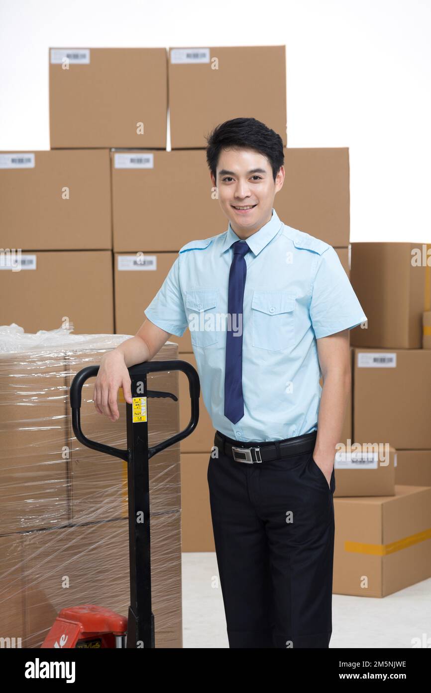 Trolley freight logistics warehouse staff Stock Photo - Alamy