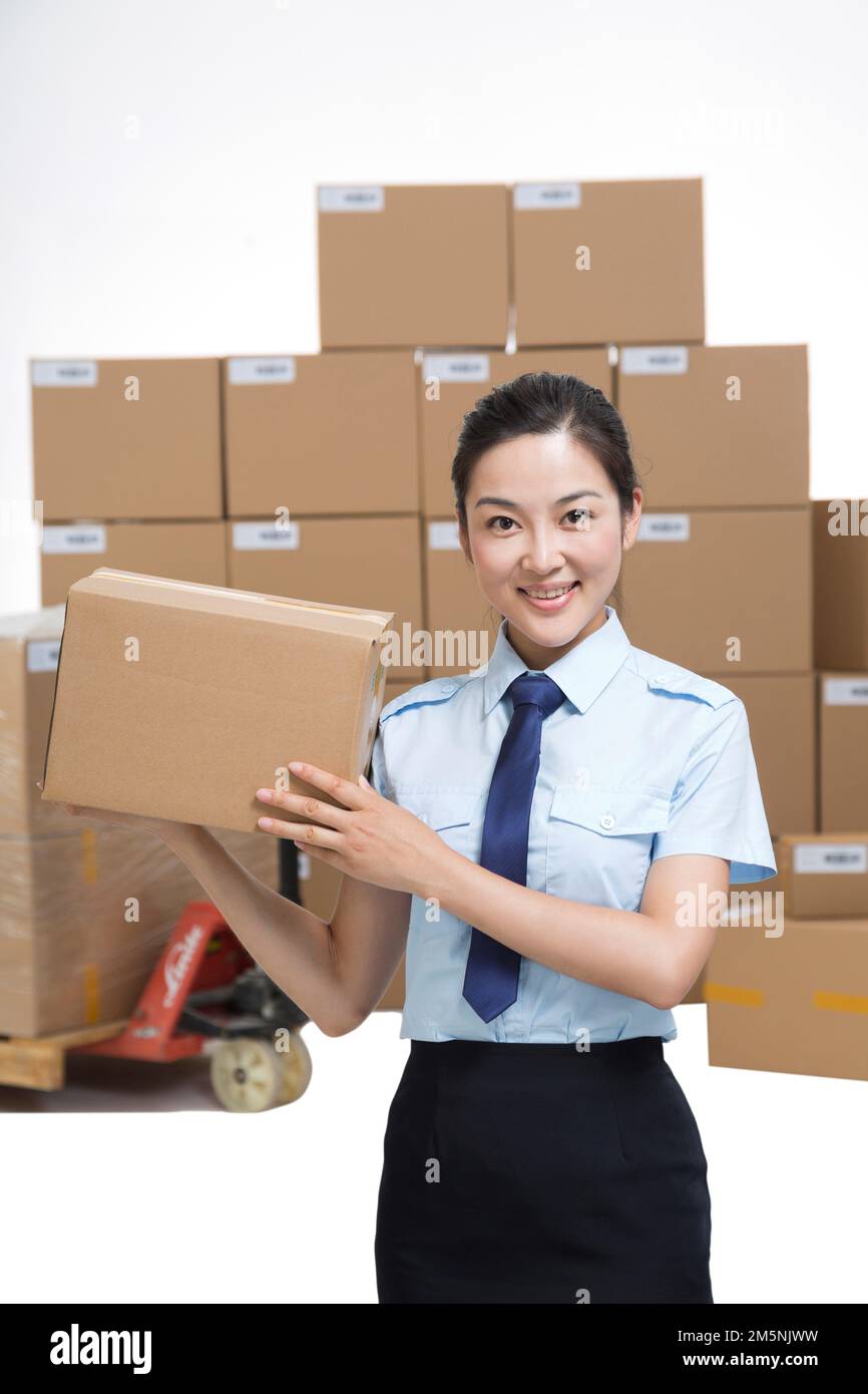 Logistics warehouse staff holding the carton Stock Photo - Alamy