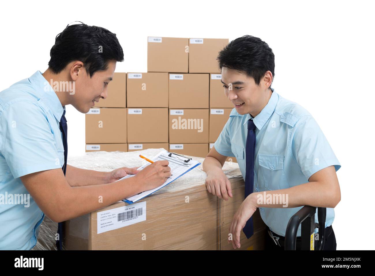 Logistics warehouse personnel in the inspection of goods Stock Photo ...