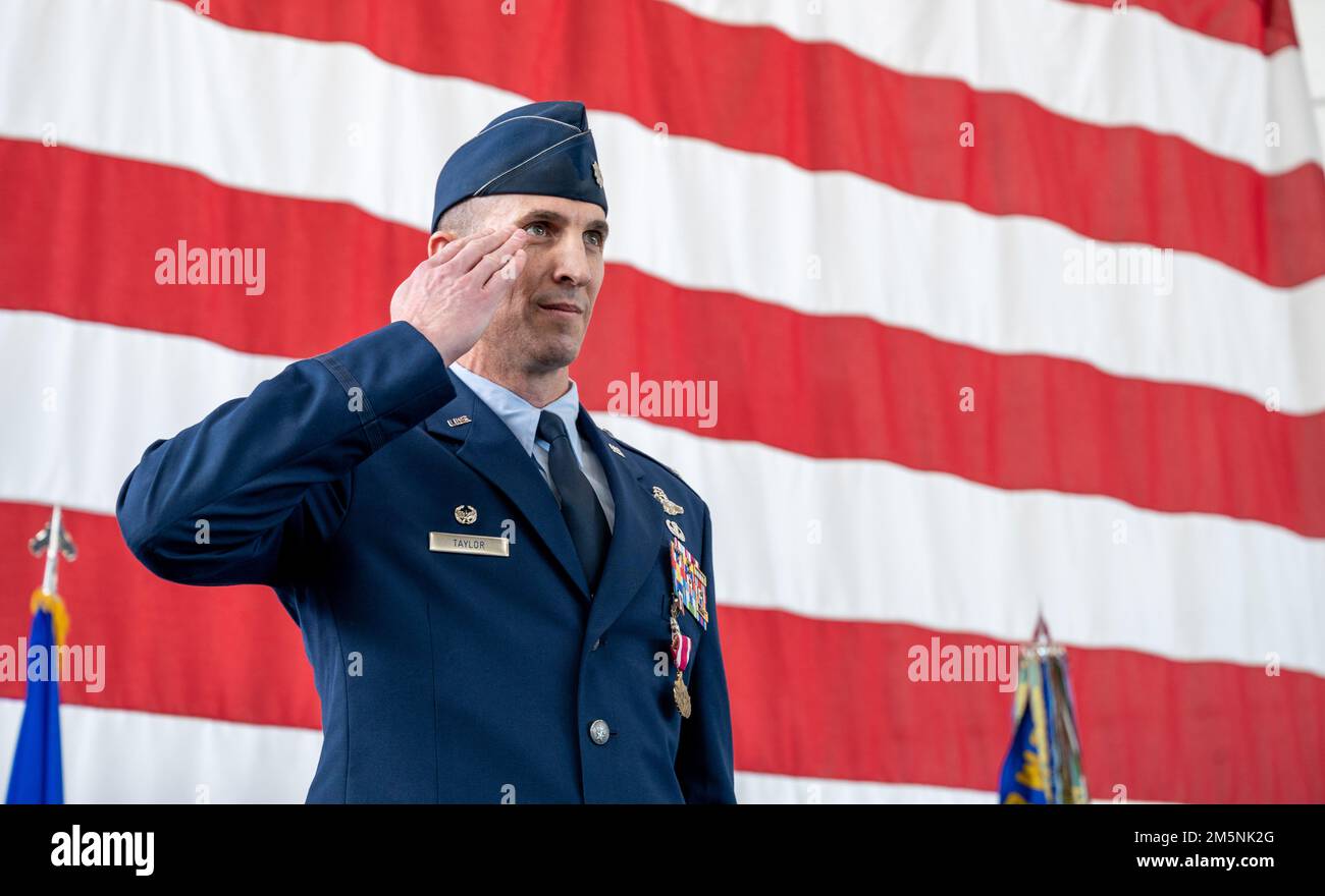 Lt. Col. Thomas Taylor, former commander of the 34th Bomb Squadron, renders a final salute to ...