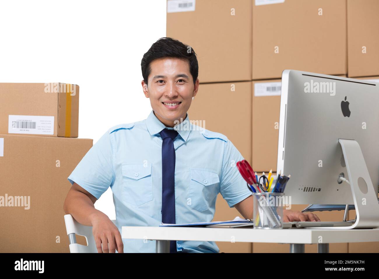 Logistics warehouse staff use office computer Stock Photo - Alamy