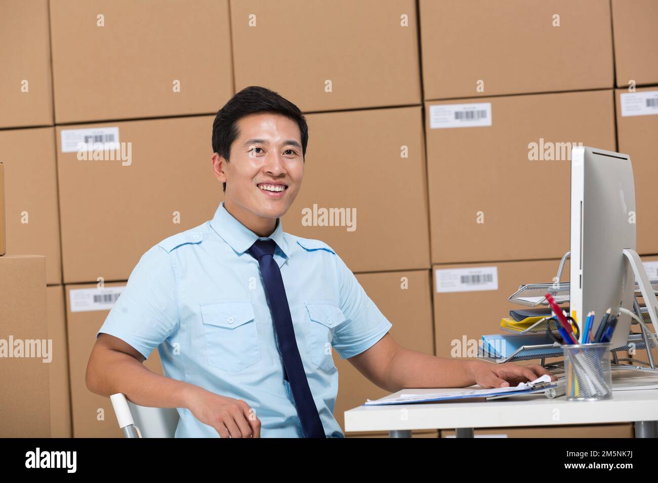 Logistics warehouse staff use office computer Stock Photo - Alamy