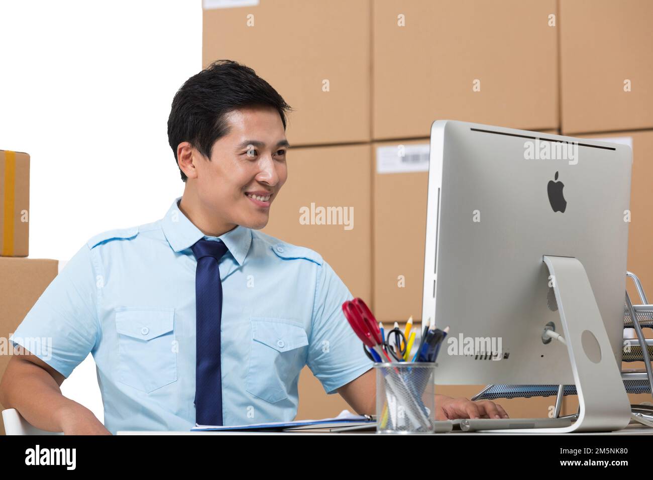 Logistics warehouse staff use office computer Stock Photo - Alamy