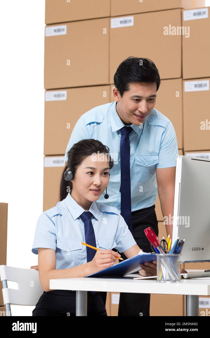 Logistics warehouse staff use office computer Stock Photo - Alamy