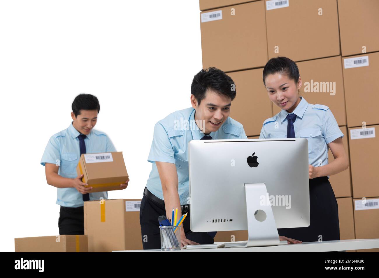 Logistics warehouse staff use office computer Stock Photo - Alamy