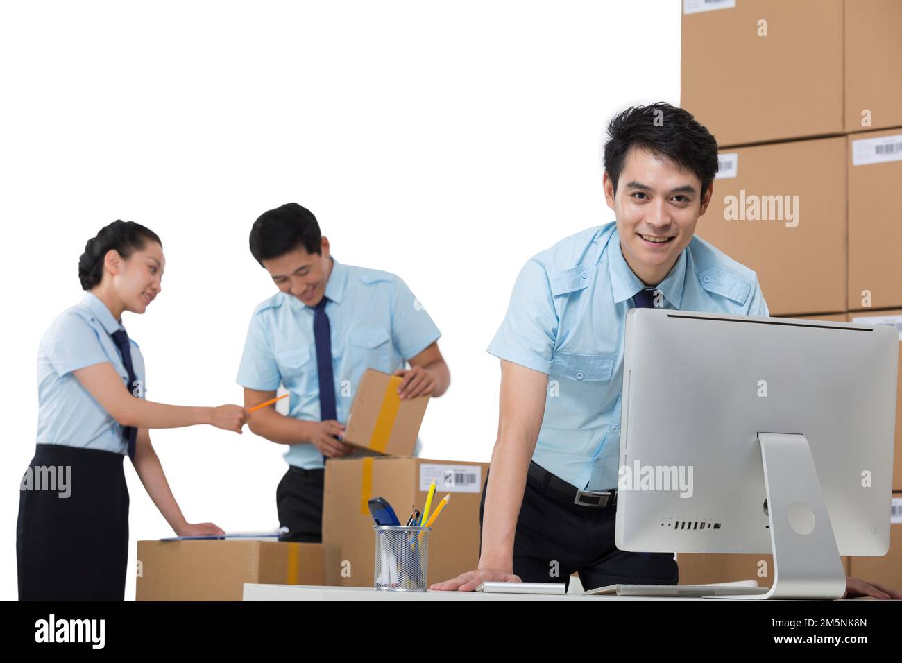 Logistics warehouse staff use office computer Stock Photo - Alamy