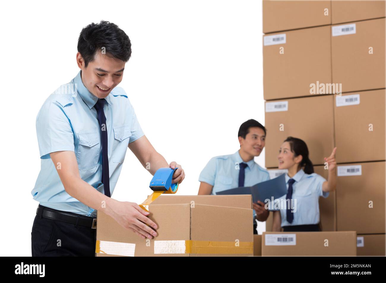 Packaged goods logistics warehouse staff Stock Photo - Alamy