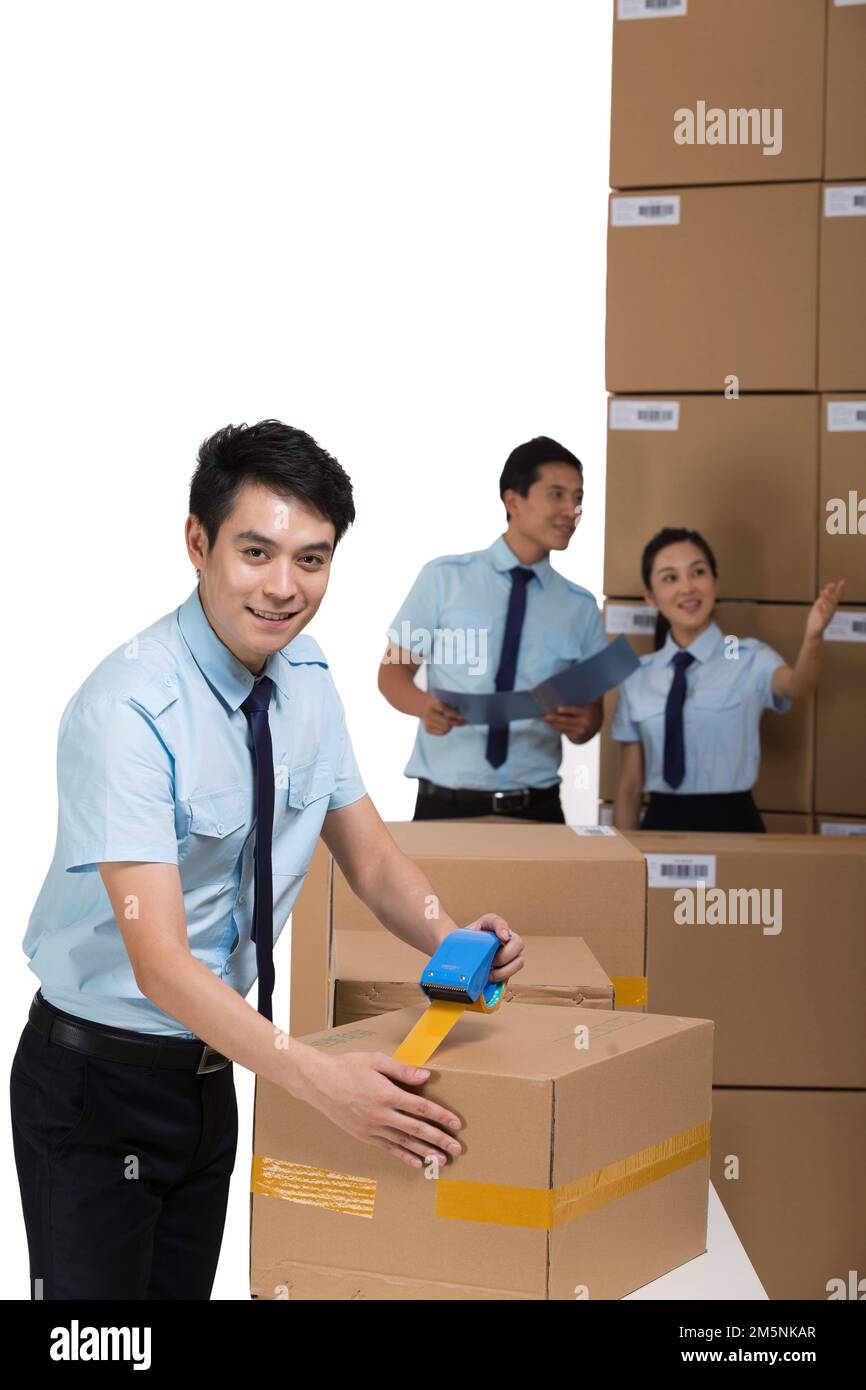 Packaged goods logistics warehouse staff Stock Photo - Alamy
