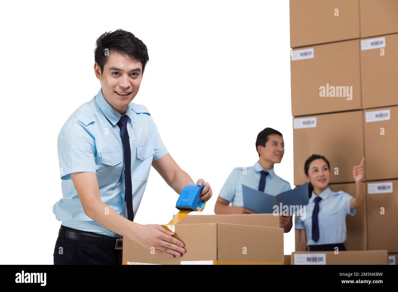Packaged goods logistics warehouse staff Stock Photo - Alamy