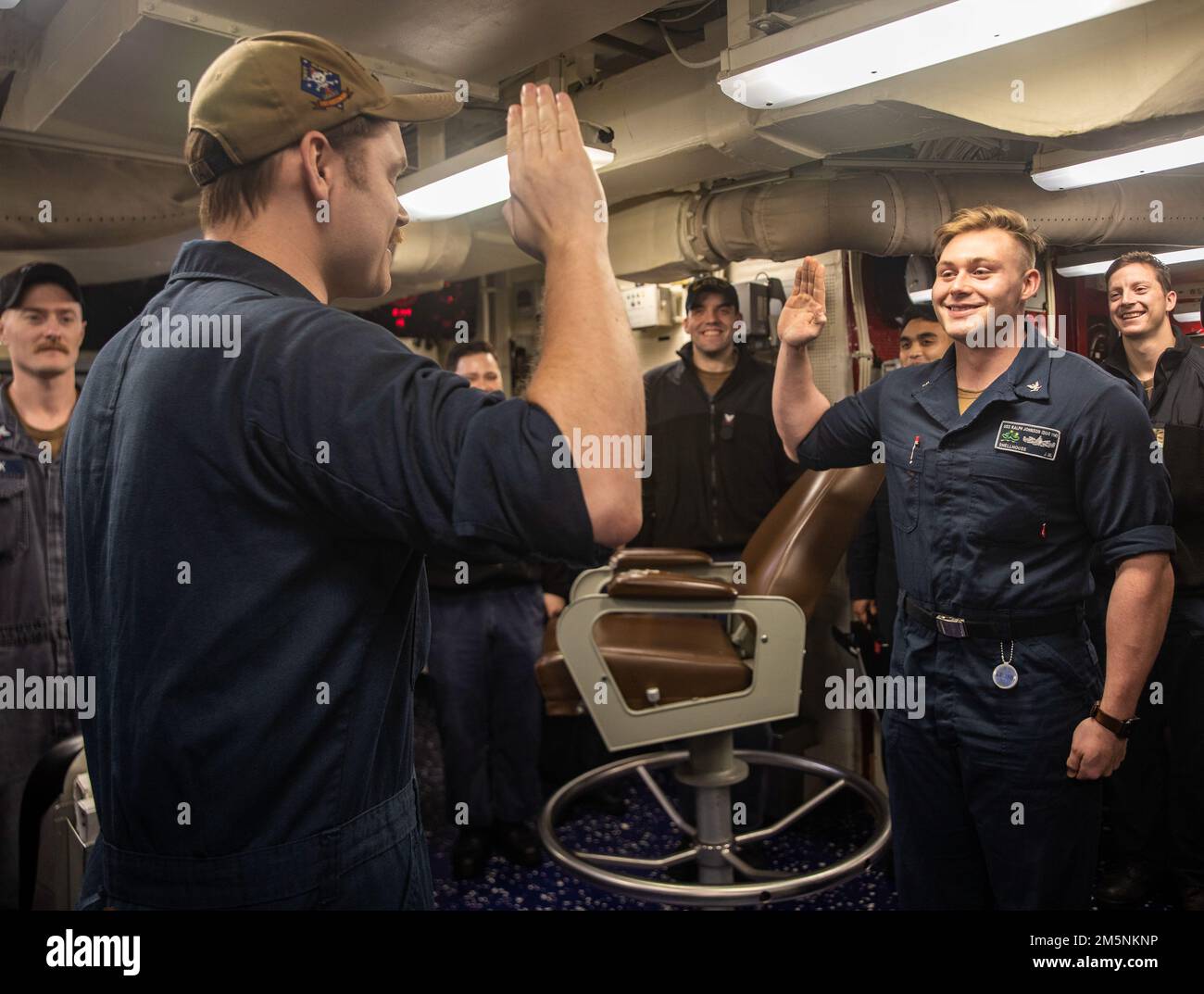SOUTH CHINA SEA (Feb. 25, 2022) Lt. j.g. Peter Hanley (left), from ...