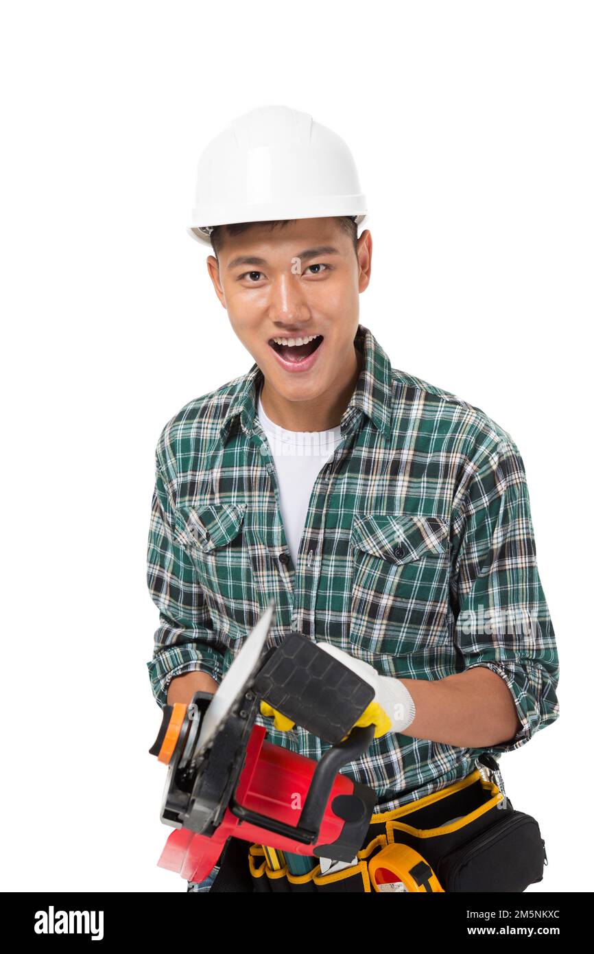 Young construction workers with a chainsaw Stock Photo - Alamy