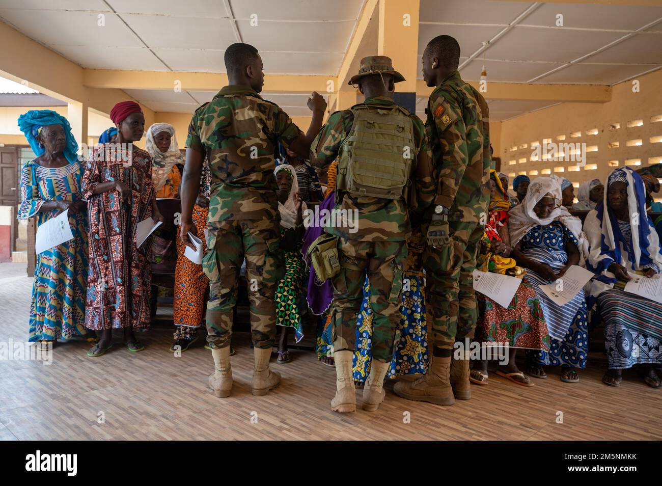 Ghanaian Army soldiers assigned to the 155th Armored Division help hand ...