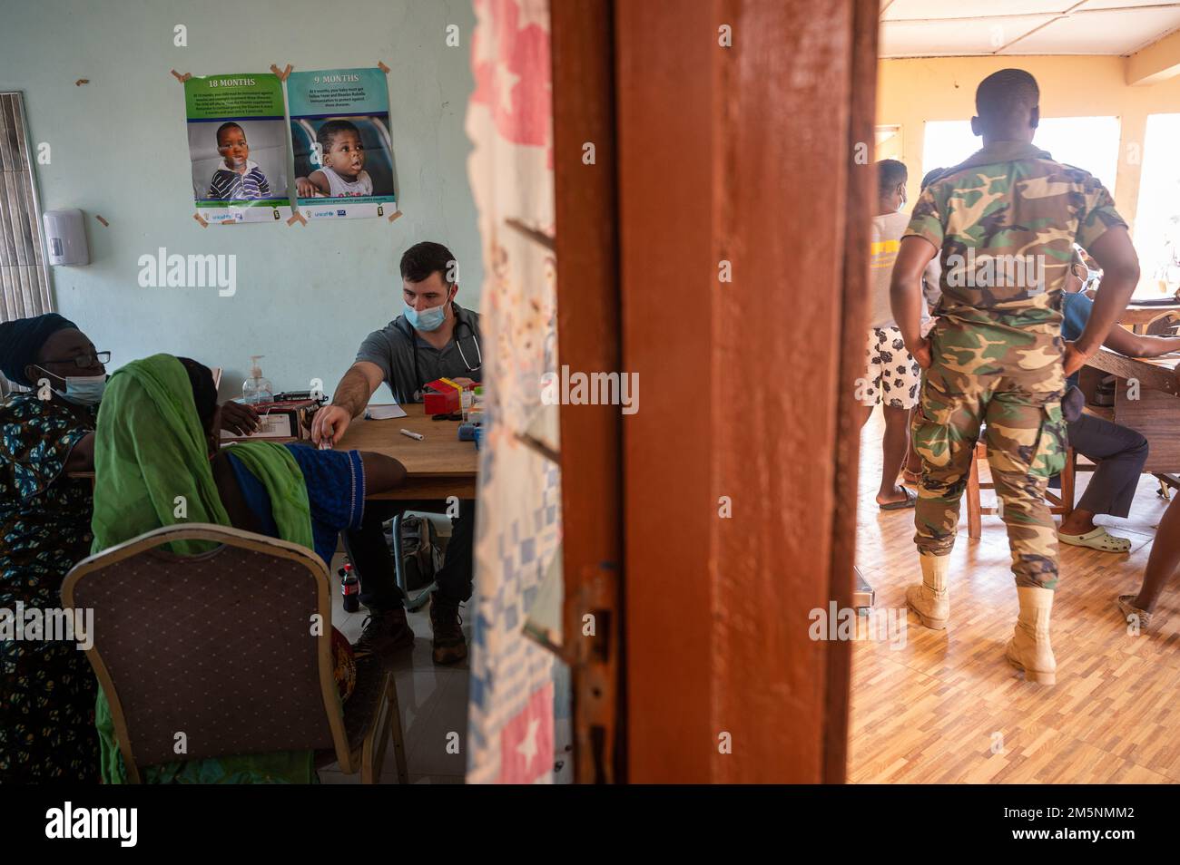 A U.S. Army Civil Military Support Element medic hands out medication ...