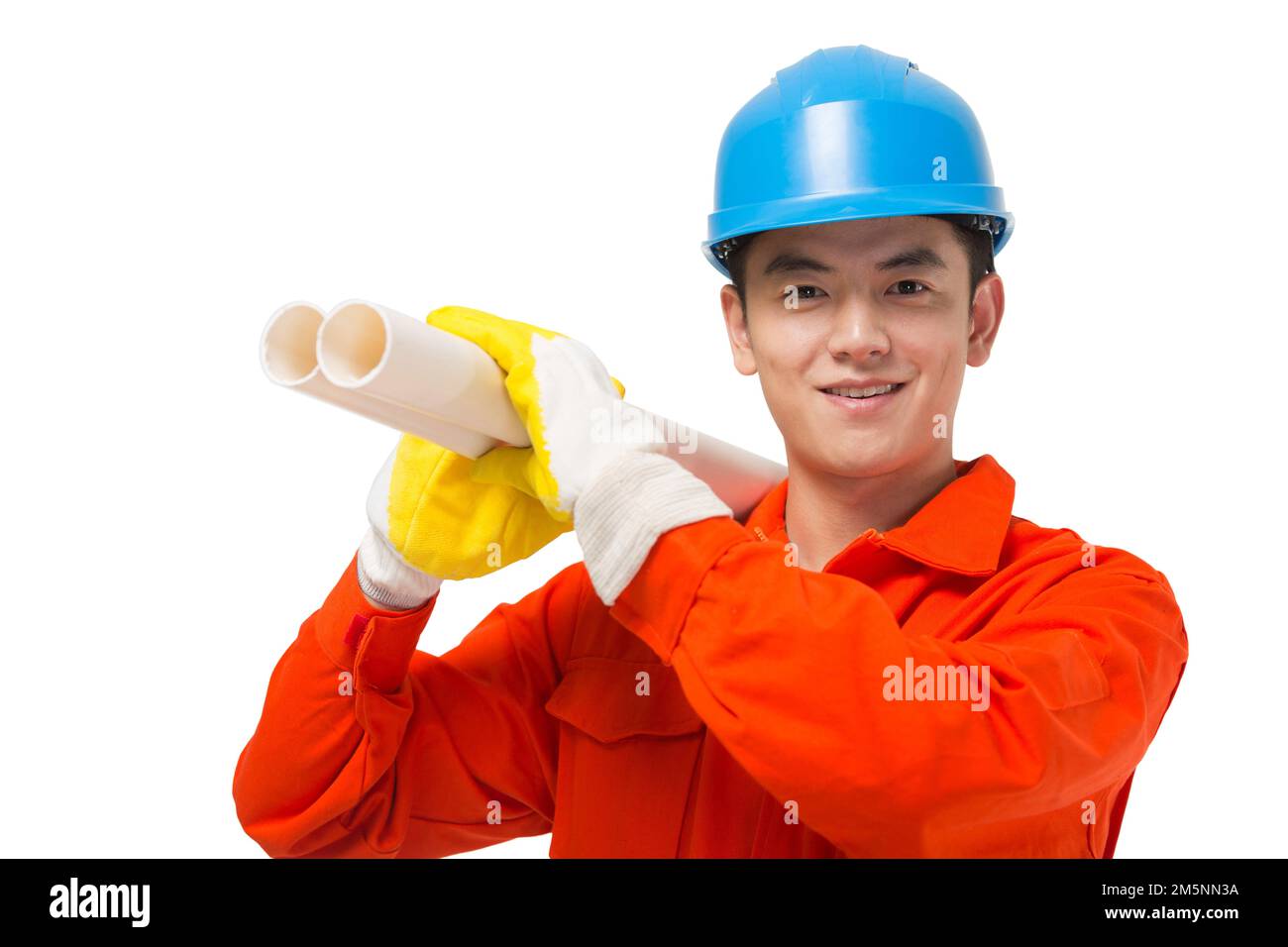 Young construction workers carry building materials Stock Photo - Alamy