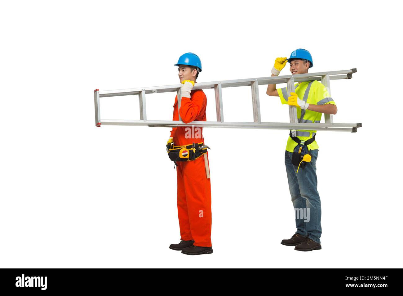 Young workers carrying a ladder Stock Photo - Alamy