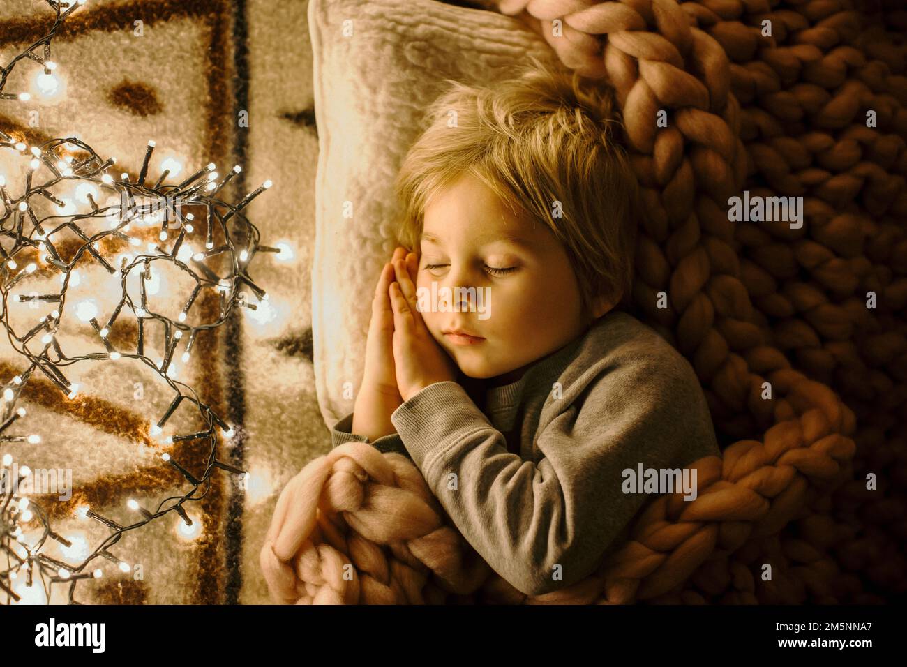 Toddler child, cute blond boy, sleeping in bed at night with christmas ...