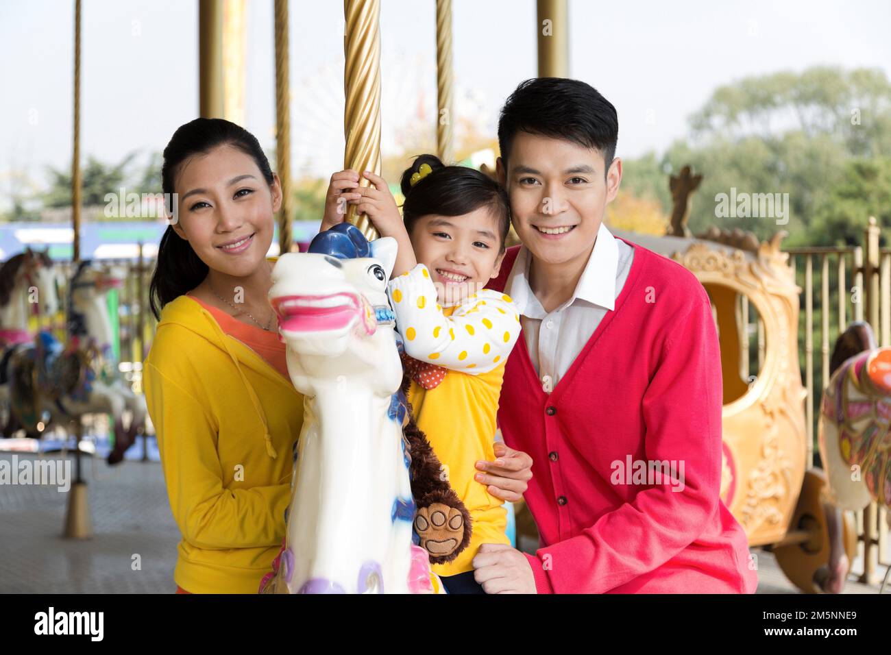 My happy to play in the amusement park ride the merry-go-round Stock ...
