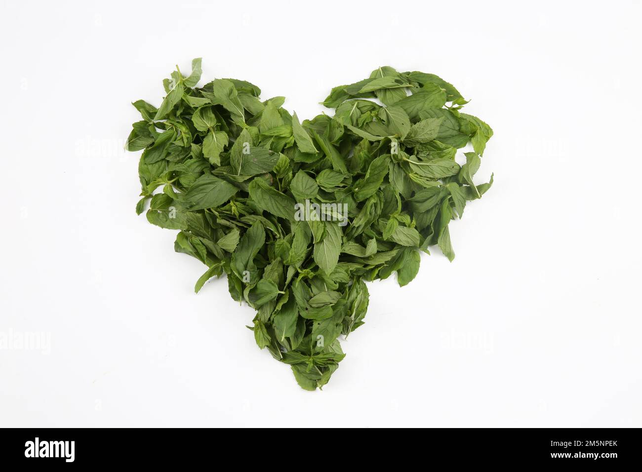 mints in heart shape on a ground Stock Photo - Alamy