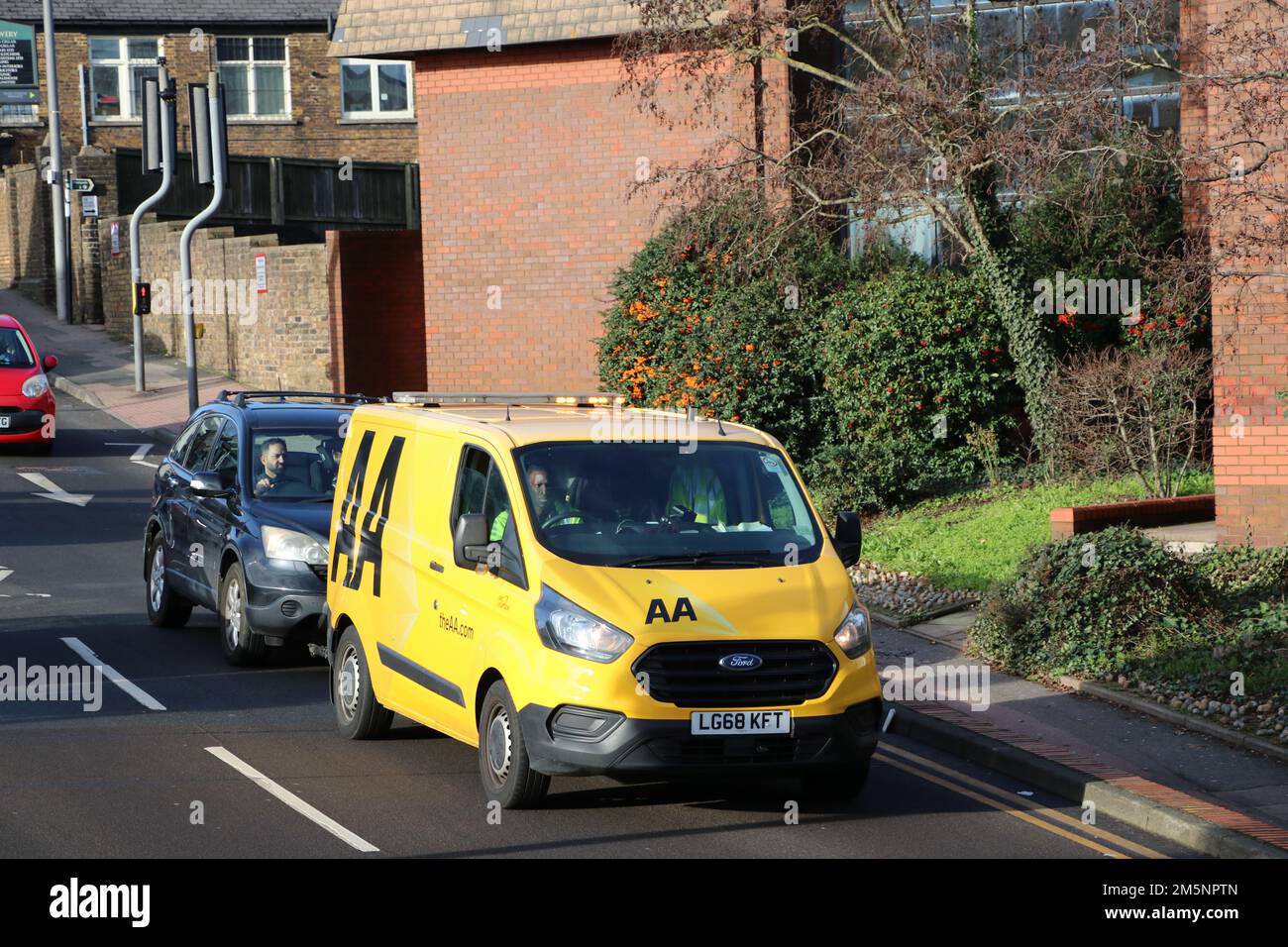 A SUNNY LANDSCAPE VIEW FROM ABOVE OF AN AA BREAKDOWN RECOVERY VAN ...