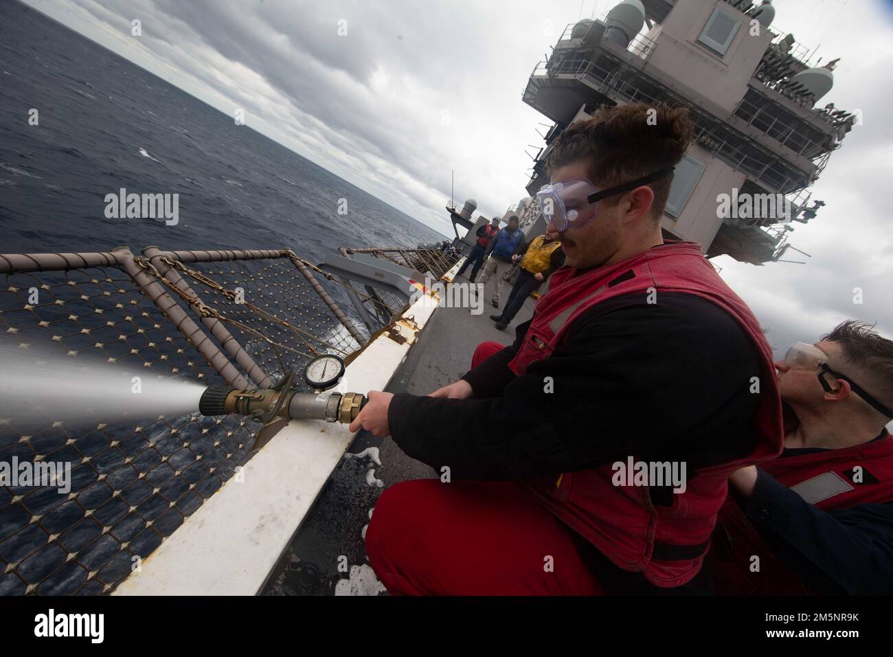 Damage Controlman Fireman Evin Huntsinger, left, from Dade City ...