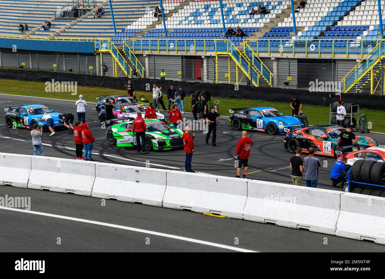 Mechanics prepare race car sports car bolides of GT4 race series GTC ...