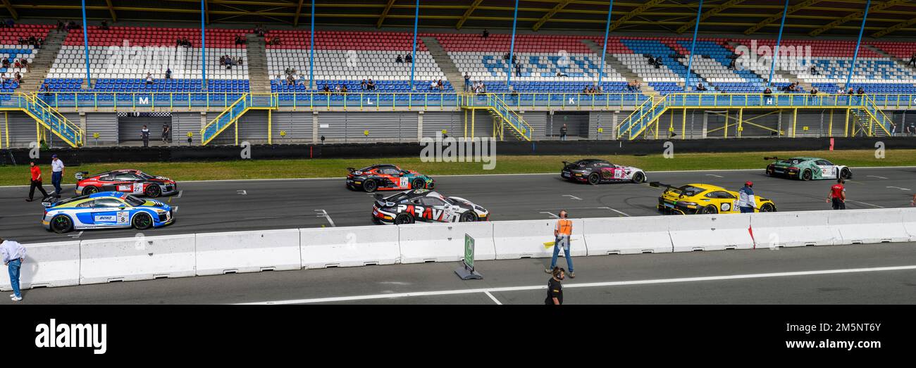 Panoramic photo of part of grid lane with starting grid of racing cars ...